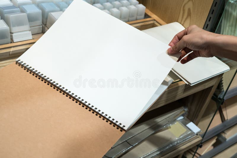 Hand Turning a Blank Page of Notebook at Stationery Shop Stock Image ...