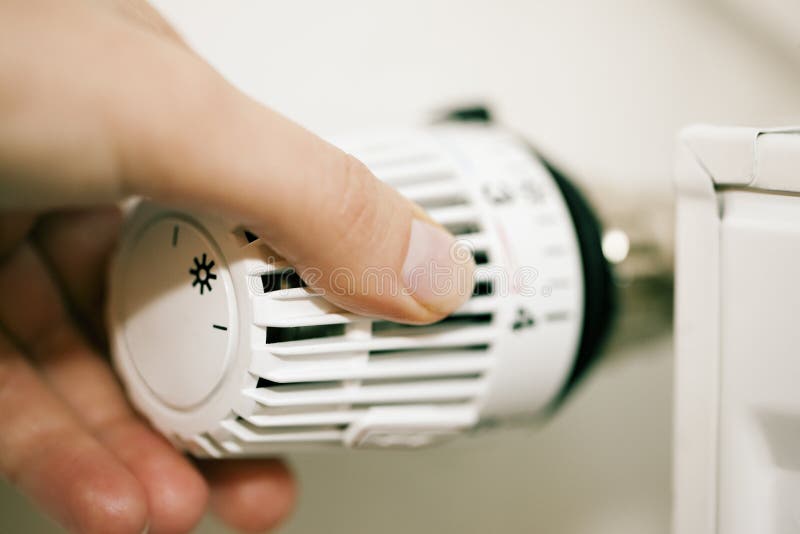 Hand Turning Down the Thermostat Stock Image - Image of temperature ...