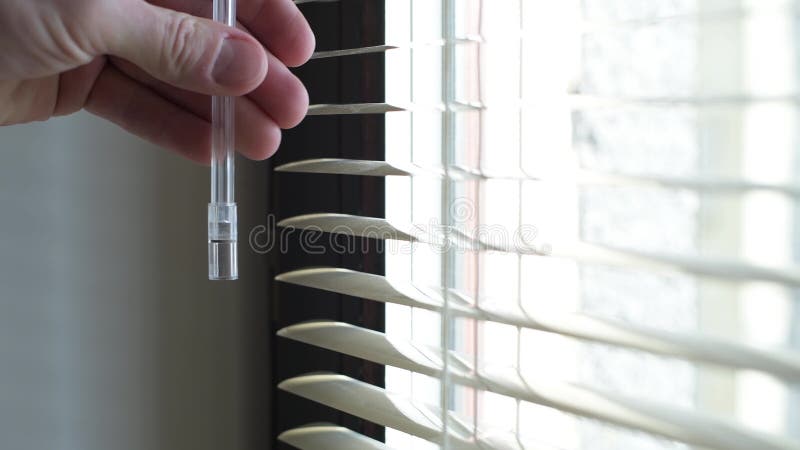 Hand by Turning the Handle Opens the Blinds, Letting in Light from the ...