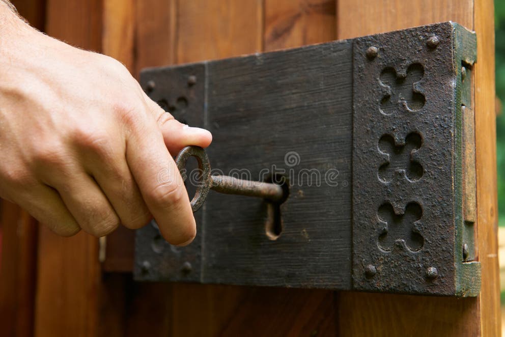 Hand Turning Key in Old Fashioned Lock Stock Image - Image of twenties ...