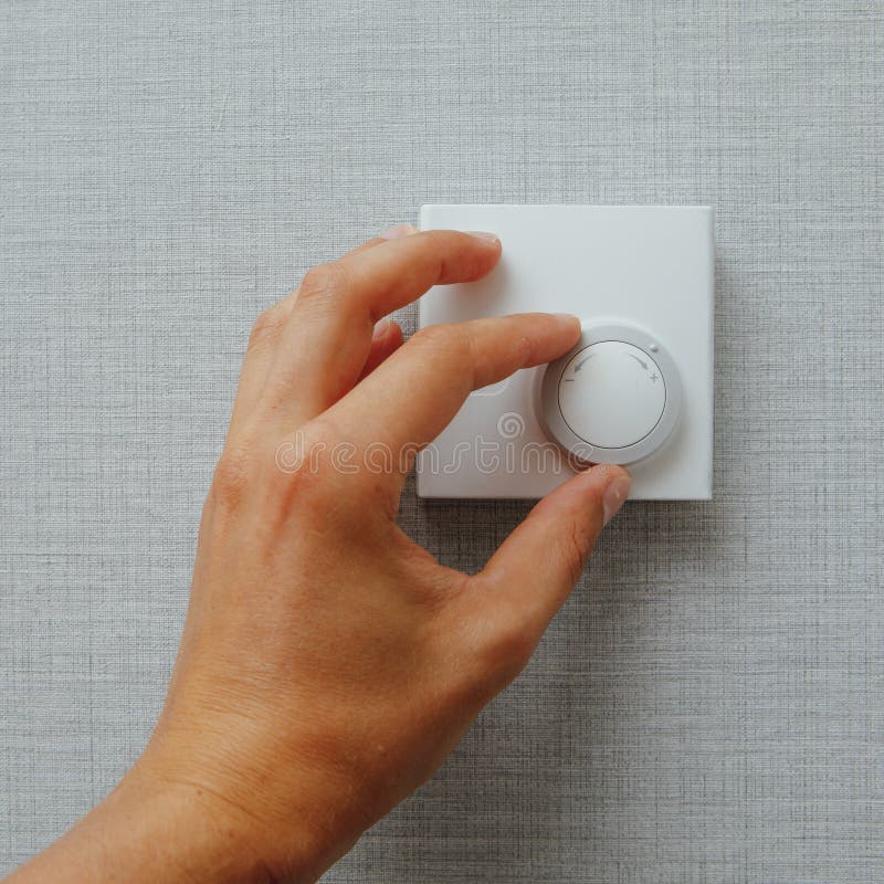 Hand Turning Knob on Thermostat Climate Control Stock Photo - Image of ... Hand Turning Knob on Thermostat Climate Control Stock Photo - Image of ...