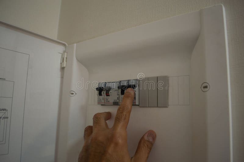 A Hand Turning on Some Electrical Switches Stock Photo - Image of ...