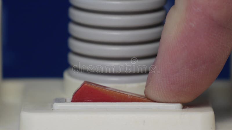 Hand Turning on the Switch, Starting the Light. One Finger Pressing the ...