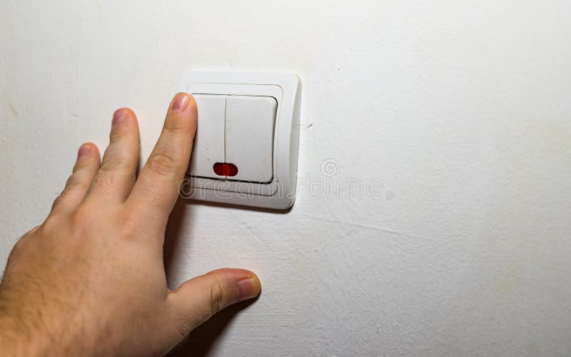 Hand Turning the Wall Light Switch on/off. Light Switch Close Up Stock ...