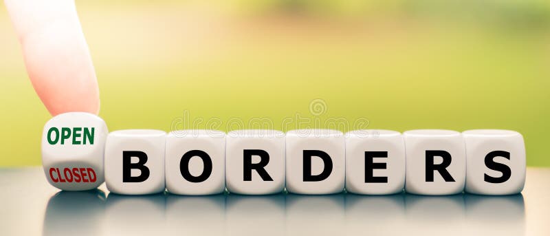 Hand Turns a Dice and Changes the Expression `closed Borders` To `open ...