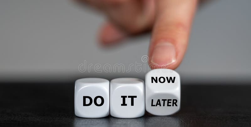 Hand Turns Dice and Changes the Expression `do it Later` To `do it Now ...