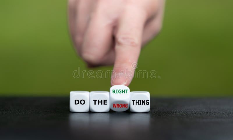 Hand Turns Dice and Changes the Expression `do the Wrong Thing` To `do ...
