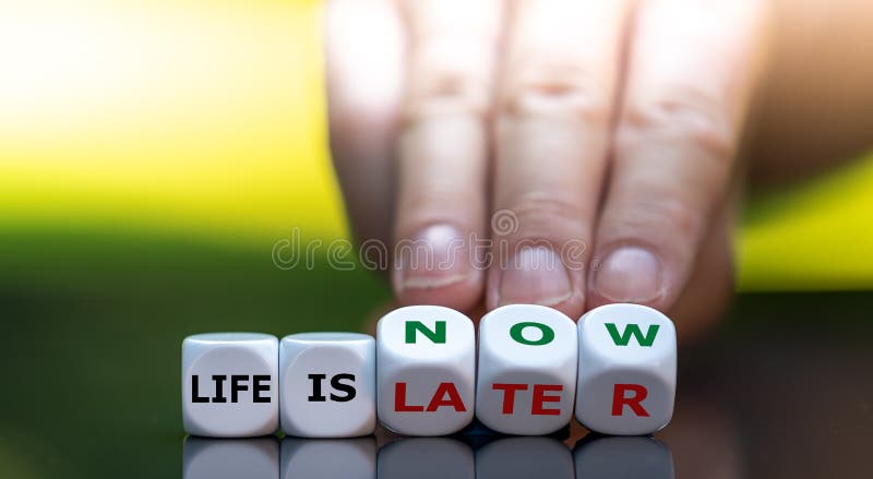 Hand Turns a Dice and Changes the Expression `life is Later` To `life ...