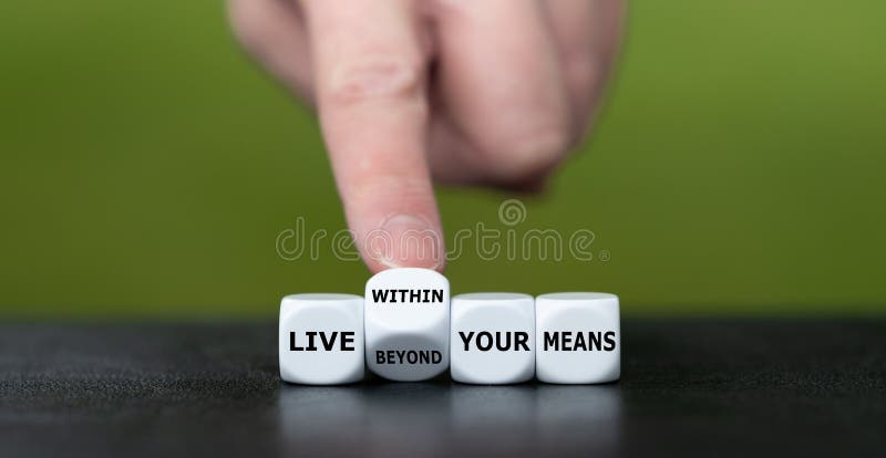 Hand Turns Dice and Changes the Expression `live Beyond Your Means` To ...