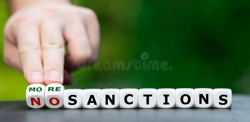 Hand Turns Dice and Changes the Expression `no Sanctions` To `more ...