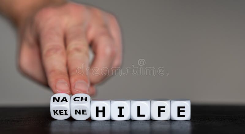 Hand Turns Dice and Changes the German Expression `keine Hilfe` No Help ...