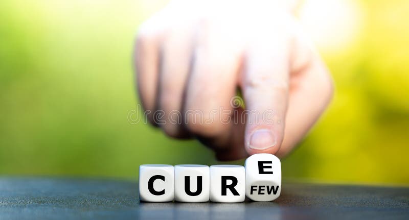 Hand Turns Dice and Changes the Word `curfew` To `cure`. Stock Photo ...