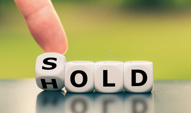 Hand Turns a Dice and Changes the Word `hold` To `sold. Stock Photo ...