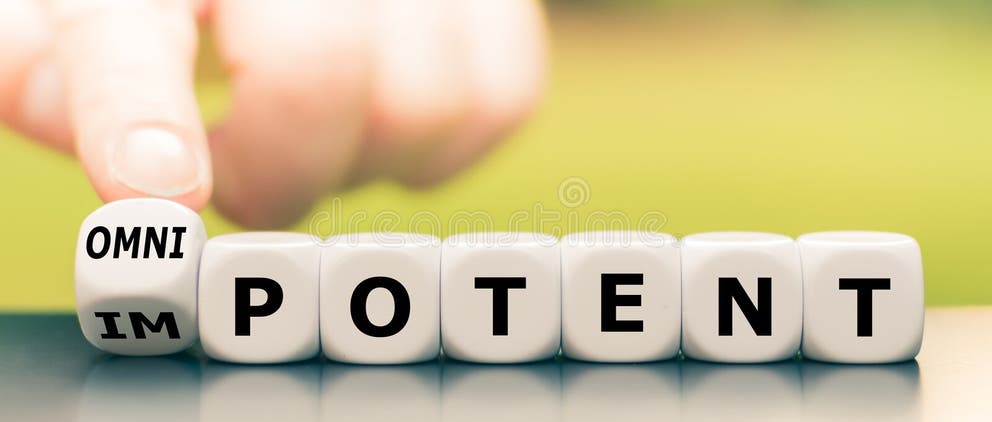 Hand Turns a Dice and Changes the Word Impotent To Omnipotent Stock ...