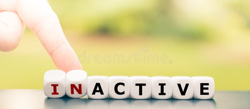 Hand Turns Dice and Changes the Word `inactive` To `active`. Stock ...