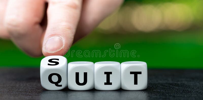 Hand Turns Dice and Changes the Word Quit To Suit. Stock Image - Image ...