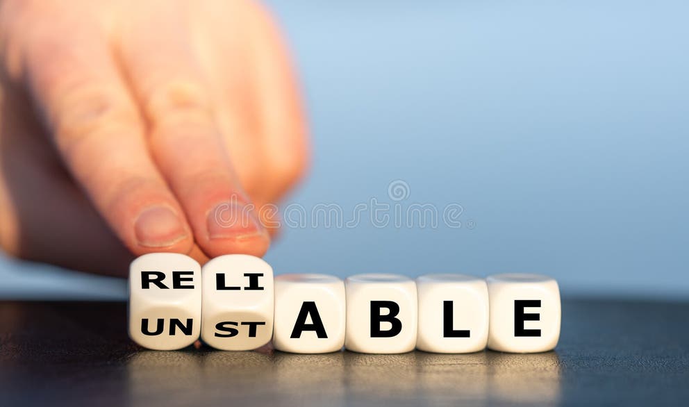 Hand Turns Dice and Changes the Word Unstable To Reliable Stock Image ...