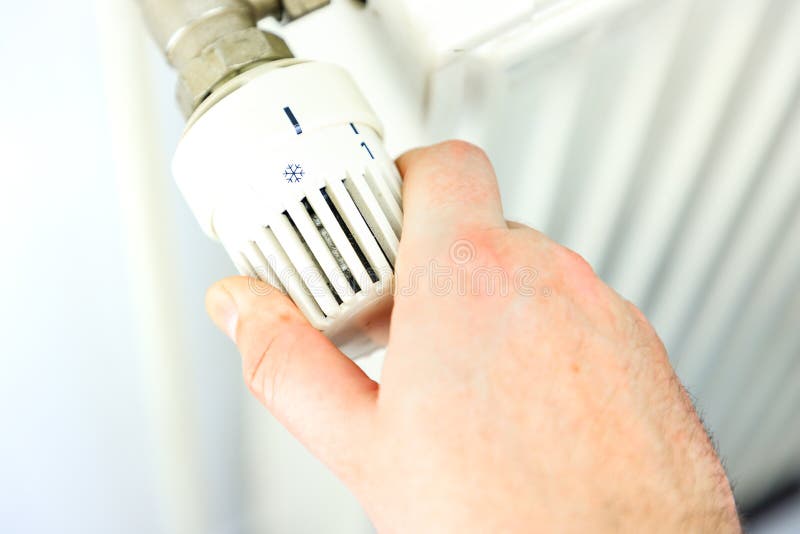 Hand Turns Down the Heating Stock Photo - Image of handle, adjust ...
