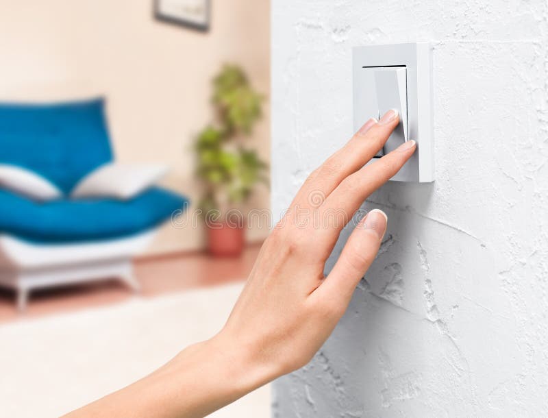 Hand Turns on the Light in the House Stock Photo - Image of close ...