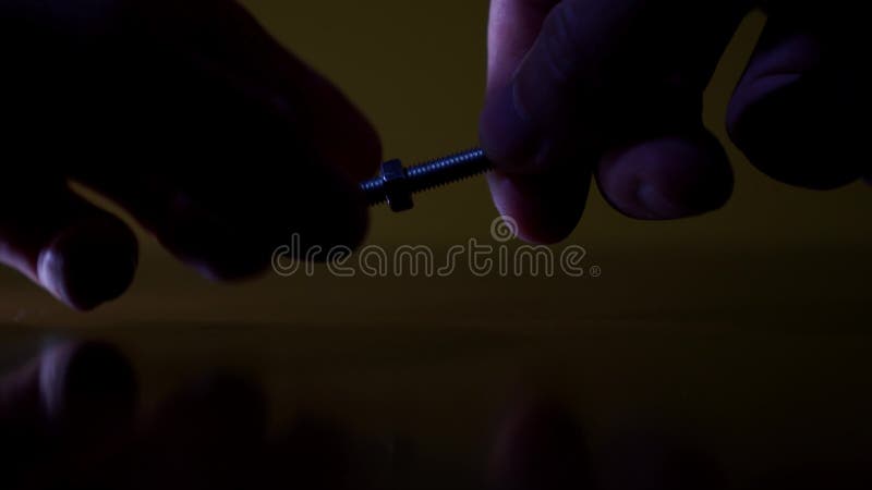 The Hand Turns the Nut of the Metal Bolt Stock Footage - Video of metal ...