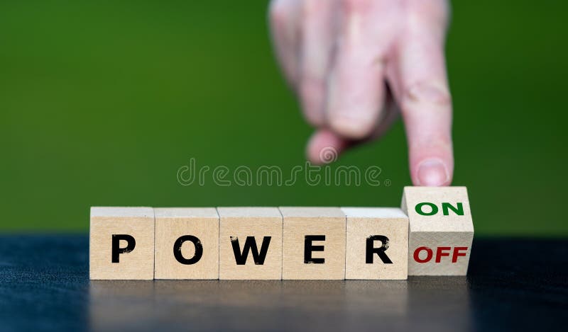 Hand Turns Wooden Cube and Changes the Expression Power Off To Power on ...