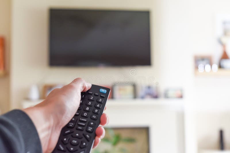 Hand with Tv Remote Control Switching Television on at Home Stock Photo ...