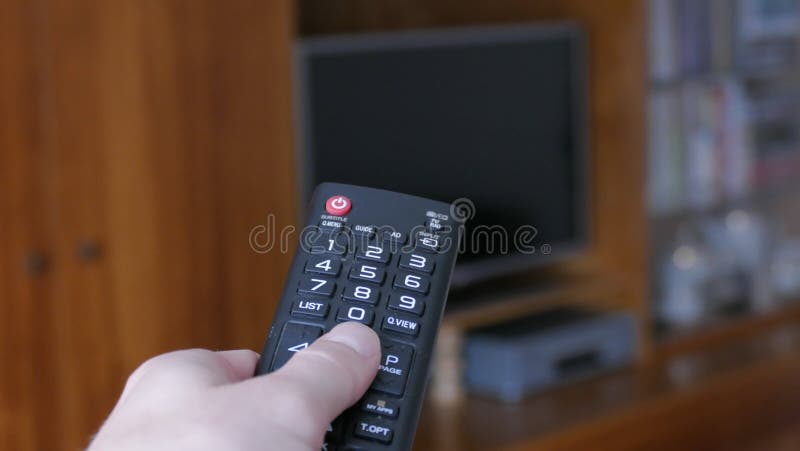 Hand with Tv Remote Control Switching Television on at Home Stock Image ...