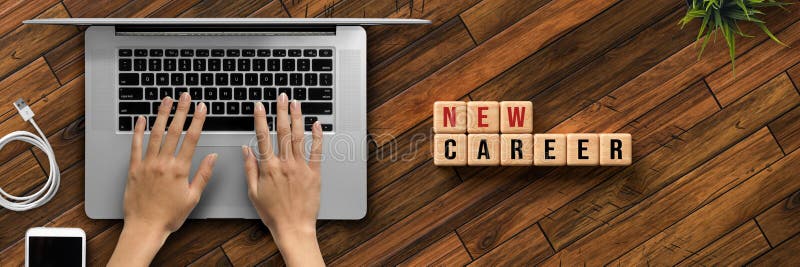 Hand is Typing on a Computer Keyboard and Cubes with Message NEW CAREER ...