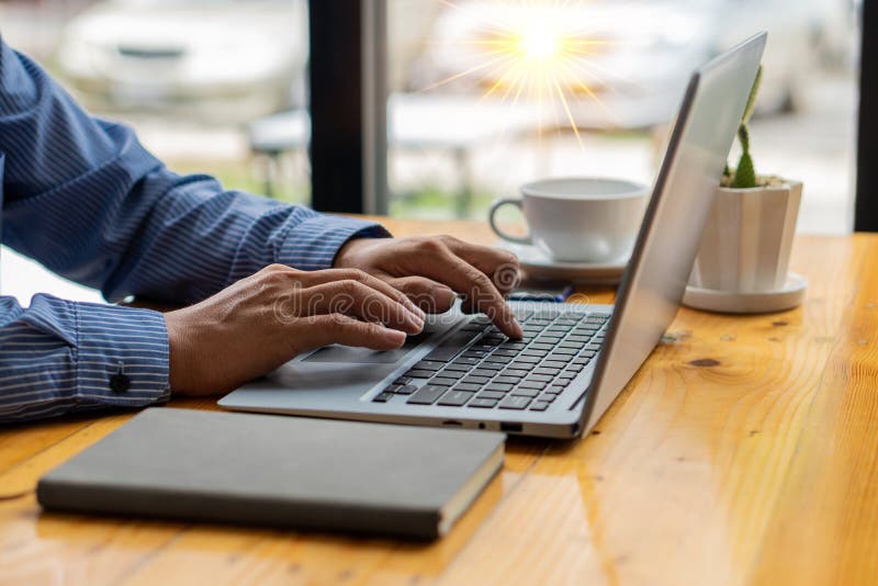Hand Typing Keyboard Manager Working on the Project in Open Space ...