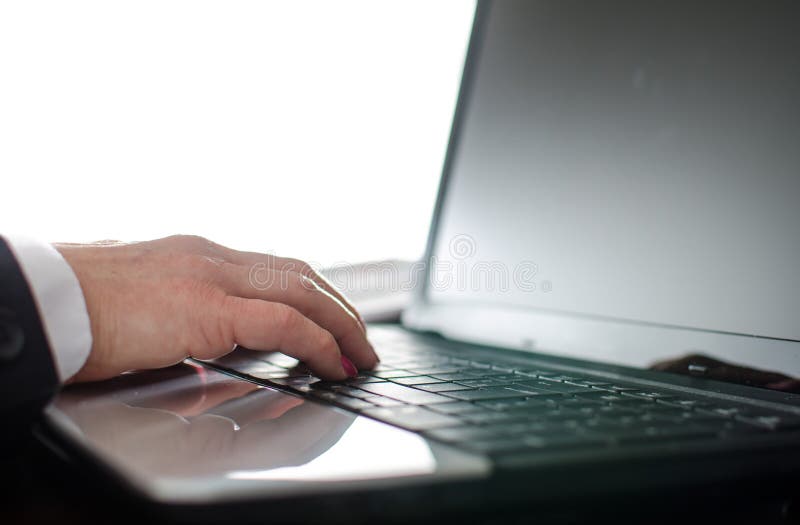 Hand typing on a laptop stock photo. Image of office - 51195046