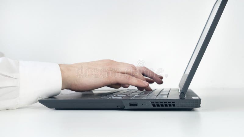 Hand Typing on Laptop Keyboard in the Office. White Table Stock Image ...