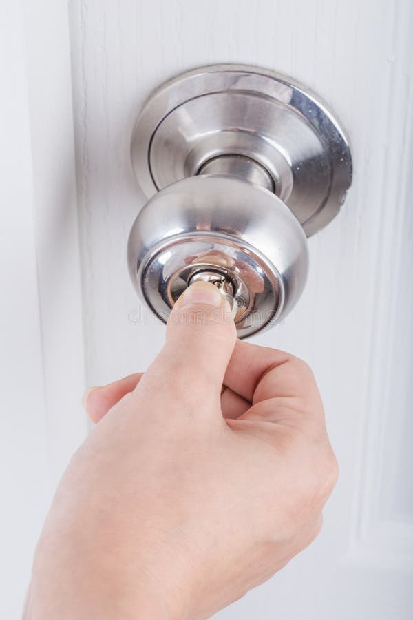Hand Use the Key for Unlocking Door Knob on White Door Stock Photo ...