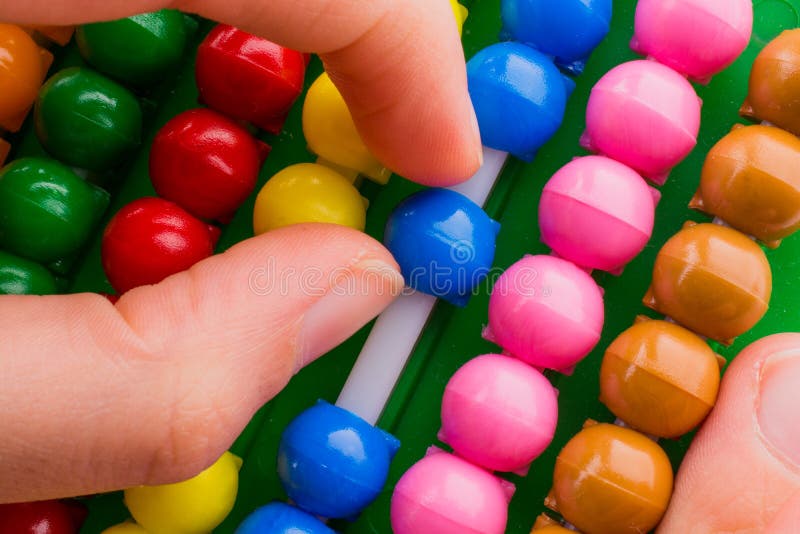Hand using an abacus stock photo. Image of number, maths - 68602786