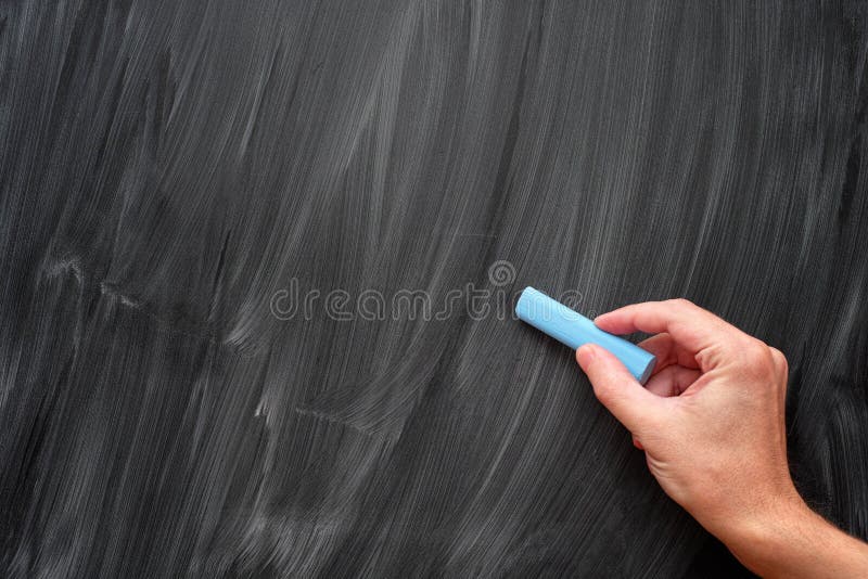 Hand Using Blue Chalk on a Black Chalkboard Stock Image - Image of ...