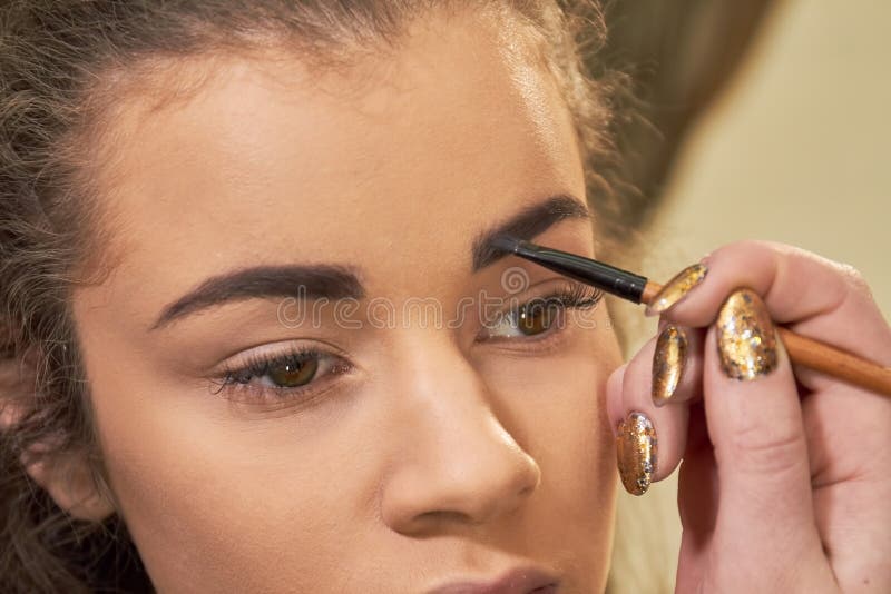 Hand using brow brush. stock image. Image of elegance - 96615049