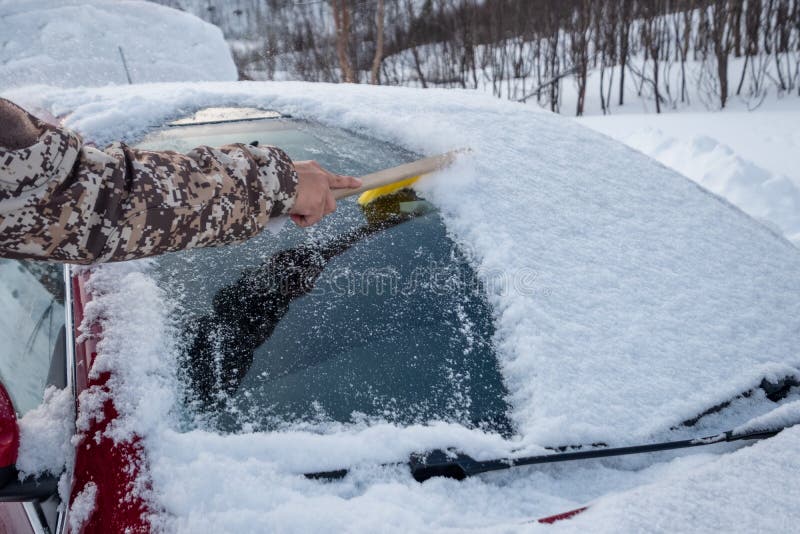 Hand Using Brush Sweeping Snow on Car Windscreen Stock Photo - Image of ...