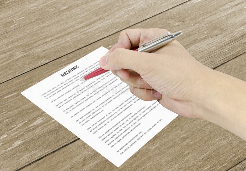 Hand Using a Classic Pen Writing on a Resume Paper Stock Photo - Image ...