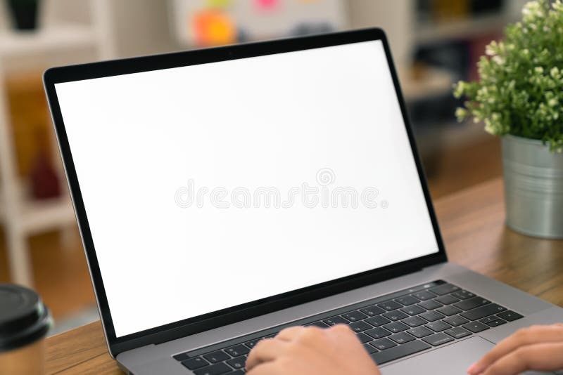 Hand Using Computer Laptop with a Blank Screen on Table, for Putting ...
