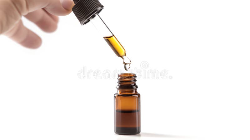 Hand Using a Dropper To Extract Liquid from a Small Brown Bottle ...