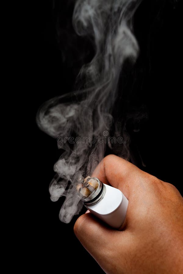 Hand Using E-cigarette/e-cig/vape. and Releasing a Smoke Stock Photo ...