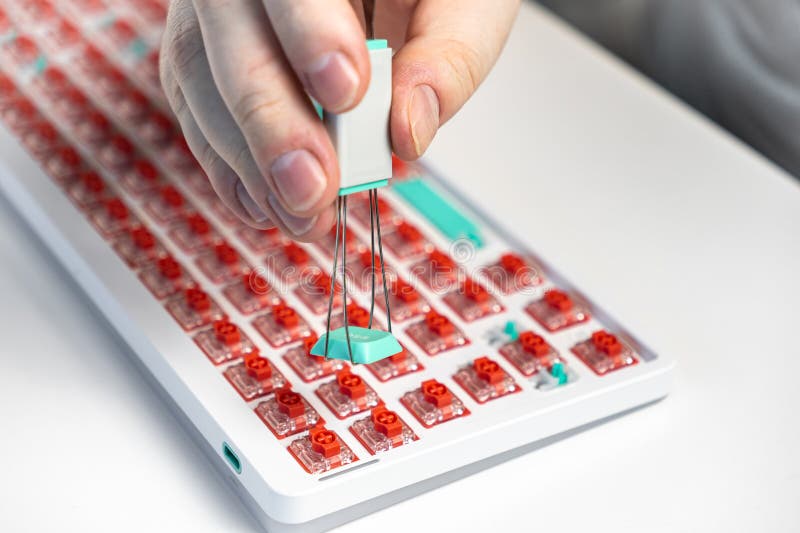 Hand Using Keycap Puller To Detach Teal Key from Red Switch Keyboard ...