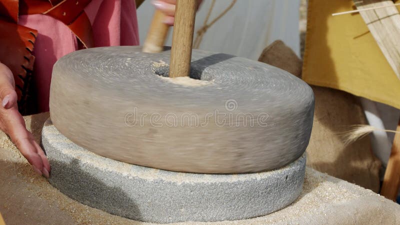 Hand Using a Large Authentic Millstone, Medieval Utensil for Grinding ...