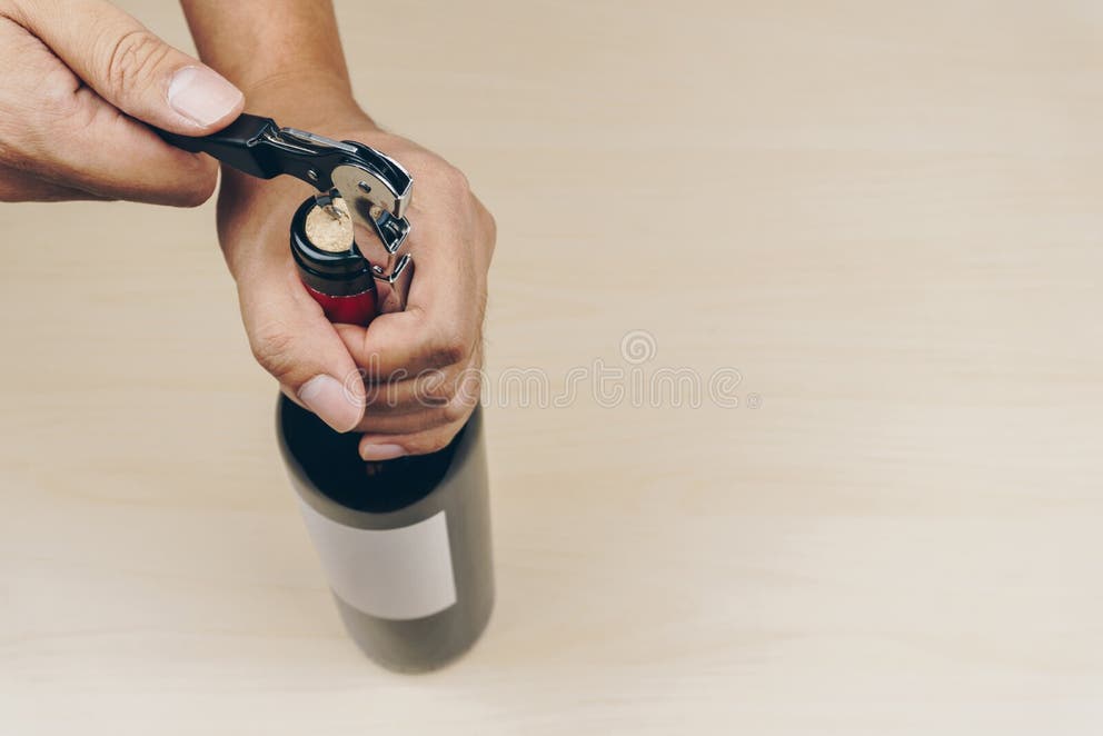 Hand Using a Metal Corkscrew Stock Photo - Image of people, liquor ...