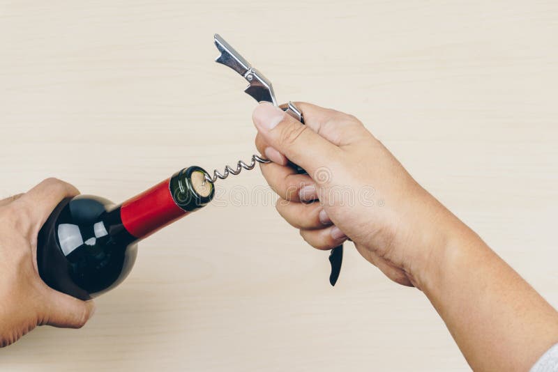 Hand Using a Metal Corkscrew Stock Photo - Image of cork, beverage ...