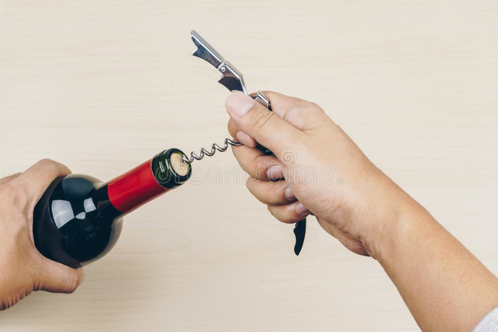 Hand Using a Metal Corkscrew Stock Photo - Image of cork, beverage ...