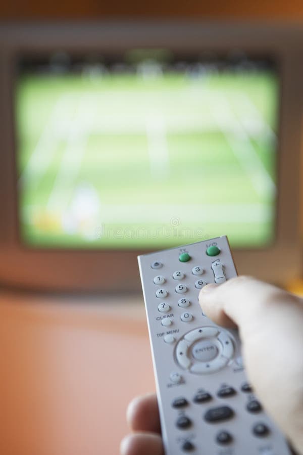 Man Using TV Remote in Living Room Stock Photo - Image of home, middle ...