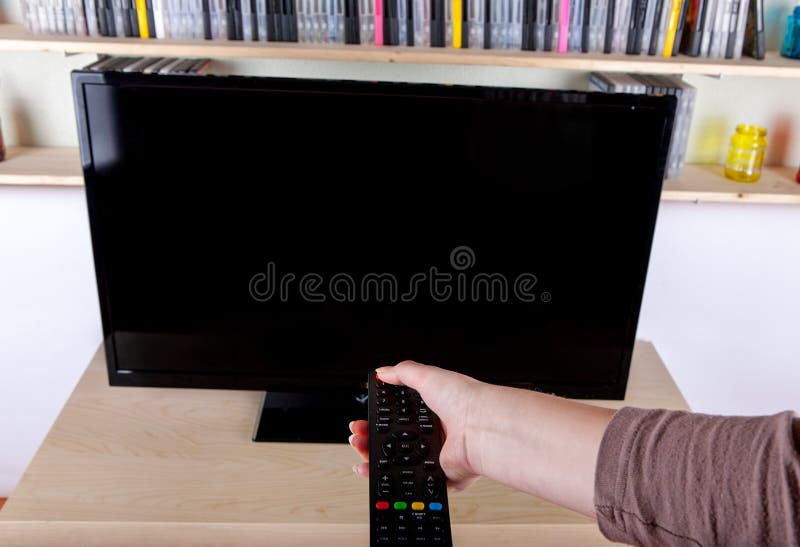 Hand Using a Remote Control To Turn Off the TV with an OFF Text Stock ...