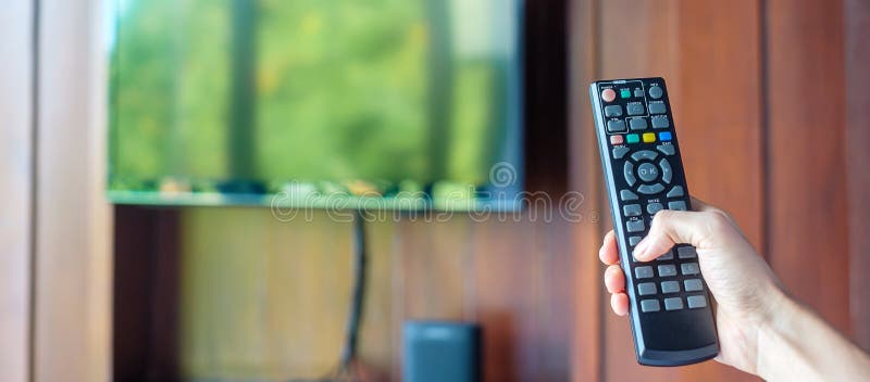 Hand Using Remote Controller for Adjust Smart TV Inside the Modern Room ...