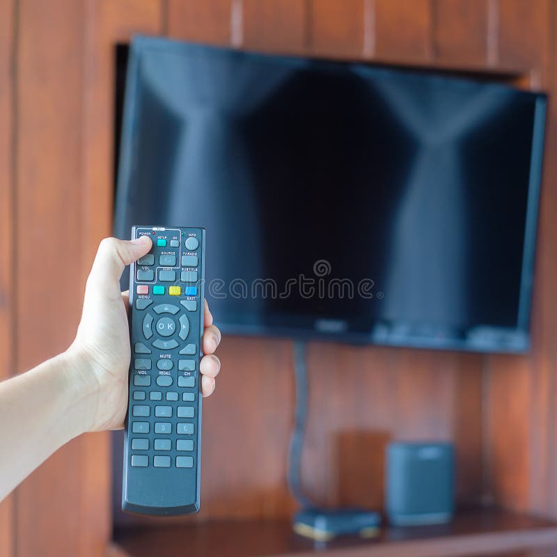 Hand Using Remote Controller for Adjust Smart TV Inside the Modern Room ...