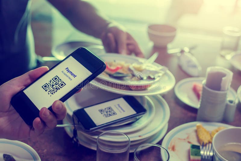 Hand Using Smart Phone To Scan QR Code on Tag with Blurry Many Dishes ...